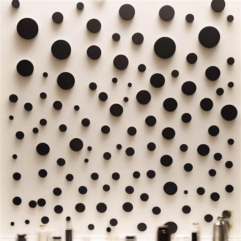 A Wall With Many Black Circles And One Has A White Background Premium Ai Generated Image