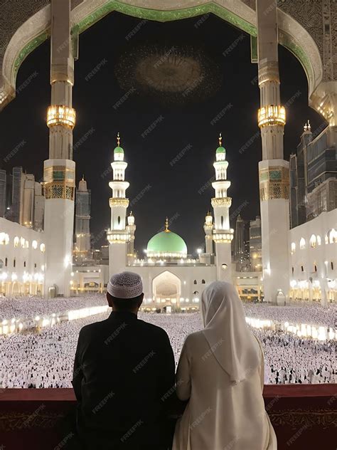 Premium Photo Husband And Wife Are Watching Makkah Sharif Together