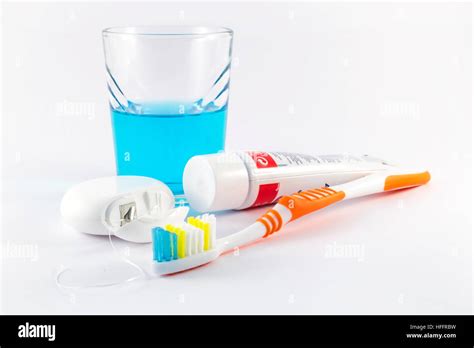 Toothbrush Dental Floss Toothpaste And Mouthwash On White Background