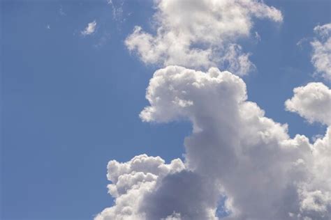 Premium Photo Clouds Floating Across The Sky In The Daytime
