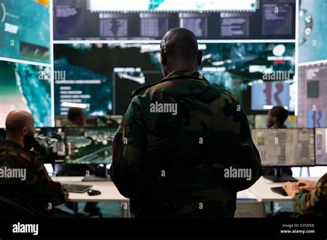 Infantry Unit Trooper Collecting Intelligence For A Field Operation Working With High Tech