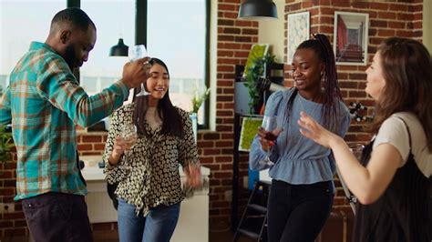 Premium Photo Group Of Friends Dancing At Apartment Party Having Fun