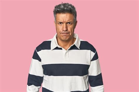 Premium Photo Middleaged Latino Man Blows Cheeks Has Tired Expression
