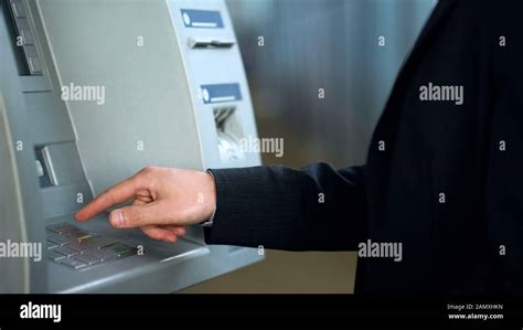 Male Hand Using ATM Typing Pin Code And Pressing Cancel Button System