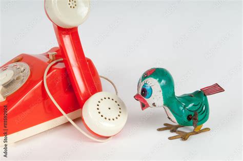 Retro orange telephone with rotary dial on white Stock-Foto | Adobe Stock
