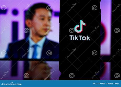 Tiktok Logo On Screen And Tik Tok Ceo Shou Zi Chew On Blurred
