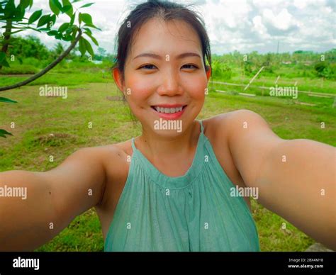 Young Happy And Attractive Asian Chinese Woman Taking Selfie Self