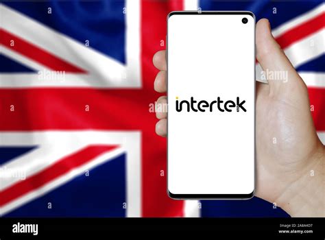 Logo Of Public Company Intertek Displayed On A Smartphone Flag Of Uk