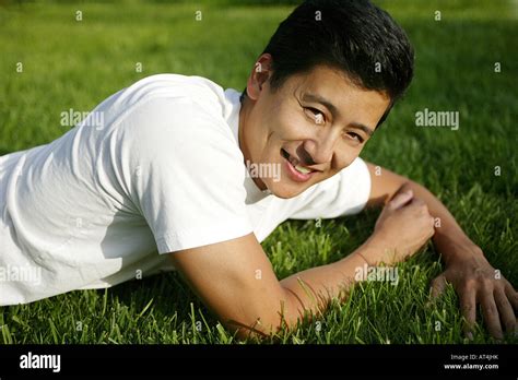 Man Lying On Grass Stock Photo Alamy