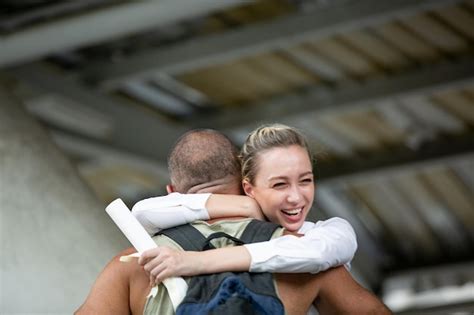 Premium Photo Happy Woman Embracing Man While Standing Outdoors