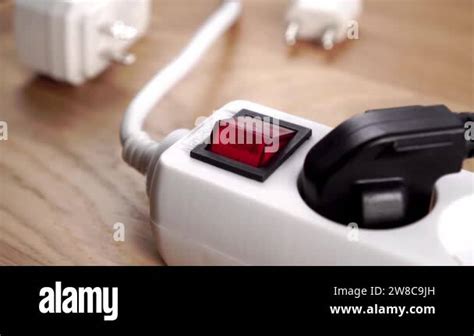 Turn Off The Electricity Supply By Pressing The Red Push Button Switch Of The White Power Strip