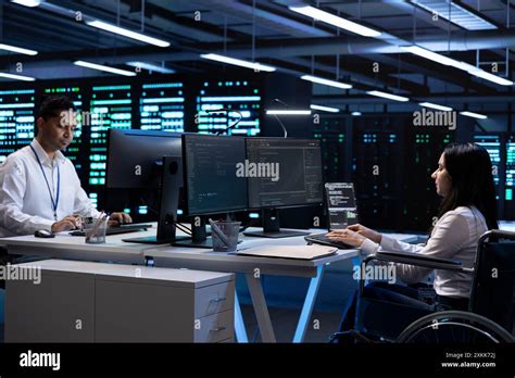 Person With Disability And Coworker In Inclusive Server Room Facility