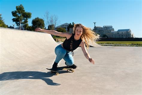 Free Photo Full Shot Girl Doing Trick On Skateboard