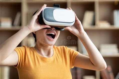 Happy Excited Surprised Teenager Asian Lady In Vr Glasses With Open