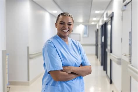 Premium Photo Portrait Of Happy Biracial Female Doctor With Short