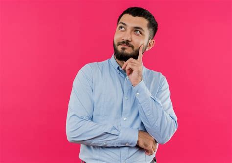 Free Photo Young Bearded Man In Black Shirt Looking At Camera Smiling