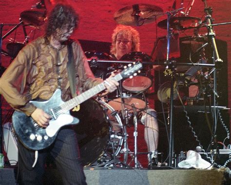 Jimmy Page Playing Guitar In Front Of Drummer Simon Phillips At Arms