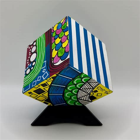 Cube Art Design A Cube Adorned With Vibrant Colors And A Prominent