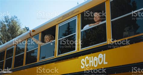 Two Multiethnic Pupils Looking Out School Bus Window Teenagers Ready To