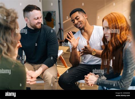 Cheerful African American Male Leader Explaining New Strategies To