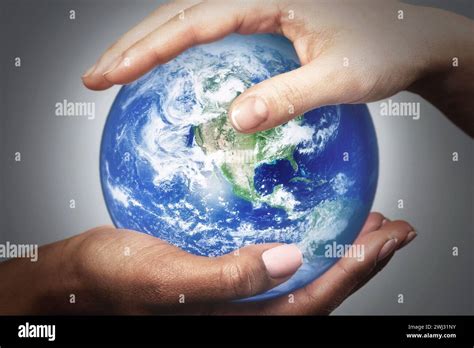 African And Caucasian Female Hands Holding Earth Globe Elements Of