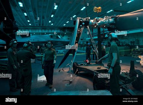 Us Marines And Us Sailors Conduct Maintenance On The Rotor Assembly