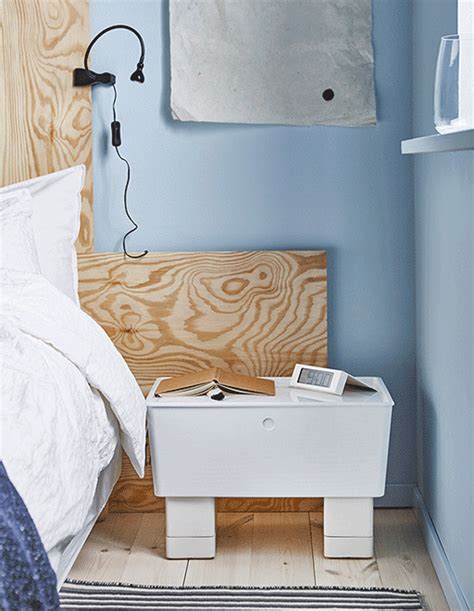 A  Showing A Nightstand Made From A Storage Box With A Lid Being Set
