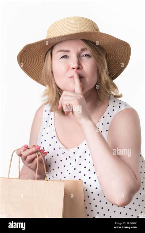 Serious Female Shopper Raised Her Index Finger To Lips Makes Secret