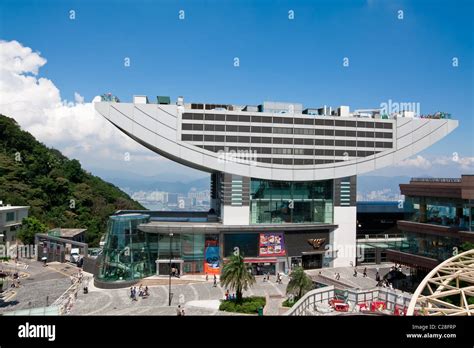 Tourists And Local Residents Are Seen Around The Peak Tower In Hong