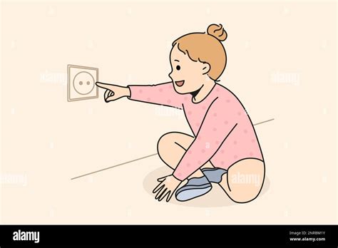 Niño Lindo Feliz De La Muchacha Estira El Dedo Al Enchufe Eléctrico En