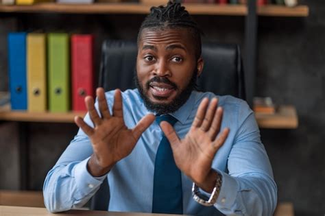 Premium Photo Scared Company Employee Pushing Someone Away From Him