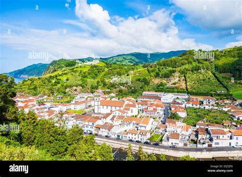 View Of Povoacao Village And Green Hills In Background Sao Miguel