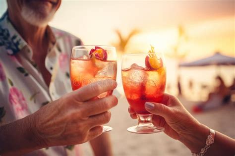 A Senior Couple Toasting Cocktails On A Sunny Beach Stock Illustration