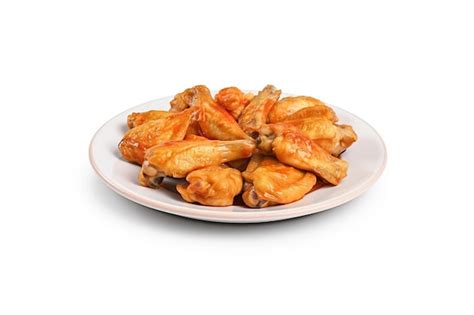 Premium Ai Image A Plate Of Baked Chicken Wings In The Asian Style
