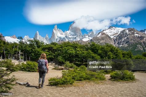 A Woman Walking On Fits Roy Trek Looking Over To Mount Fitz Roy In Los