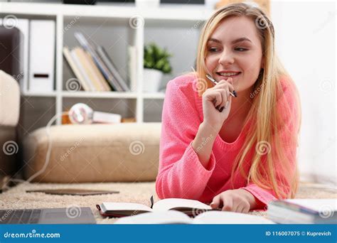 Young Beautiful Blond Woman Lie On The Floor Read Book Stock Image