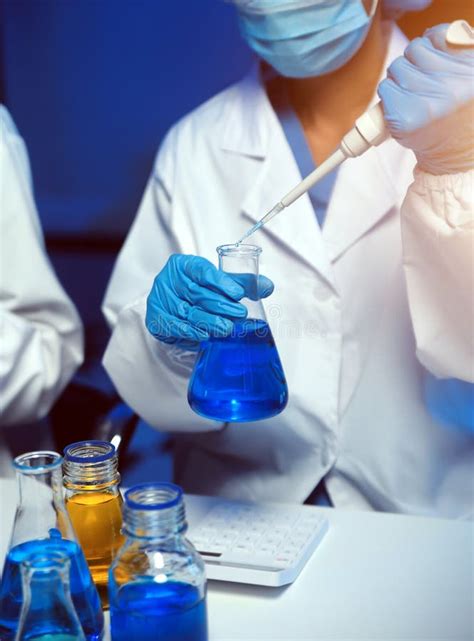 Professional Chemist Woman Laboratory Using Scientific Microscope For Science Research