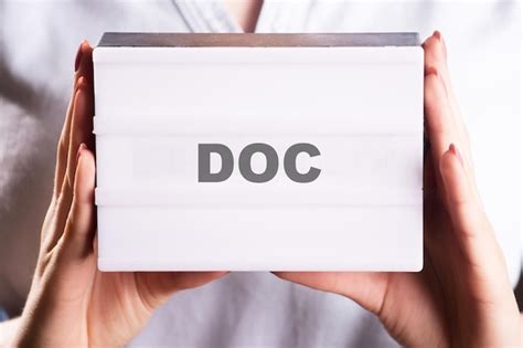 Premium Photo Woman Holding With Both Hands A Sign That Says Doc