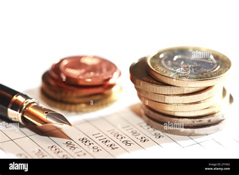 Closeup Of Coins Stack On Paper Background With Digits Stock Photo Alamy