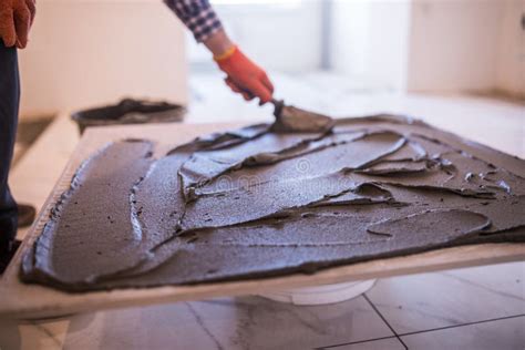 Laying Ceramic Tiles Master Make Concrete Floor In Preparation For