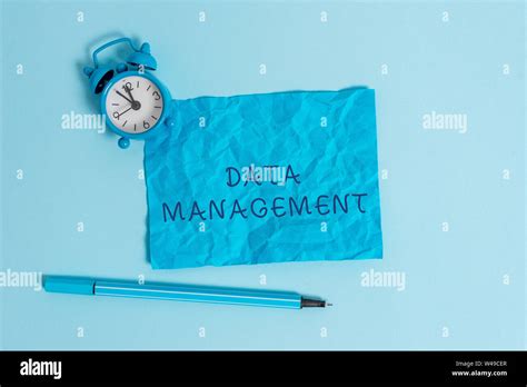 Writing Note Showing Data Management Business Concept For The Practice Of Organizing And