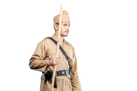 Premium Photo Indonesian Warrior Standing While Holding Sharpened