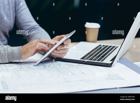 Close Up Photo Of Hands Of Male Designer Architect Working With Tablet