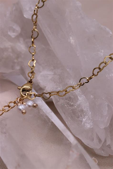 פרשס צמיד לבבות זהב עם פנינים Tao