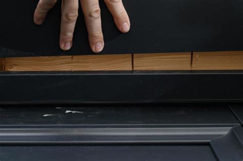 Checking The Door Frame For Evenness Of The Surface After Installation