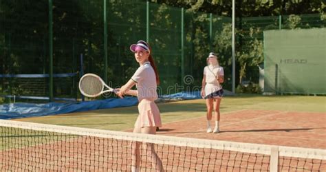 Ginger Beautiful Tennis Player Prepares To Serve Tennis Ball During