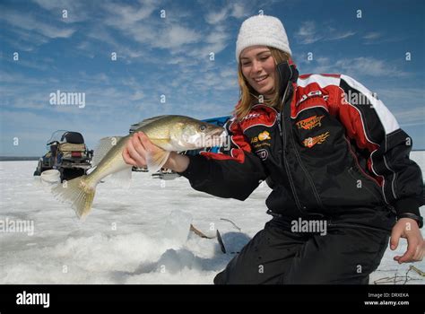 A Young Girl Holds Up A Winter Walleye She Caught Ice Fishing Stock