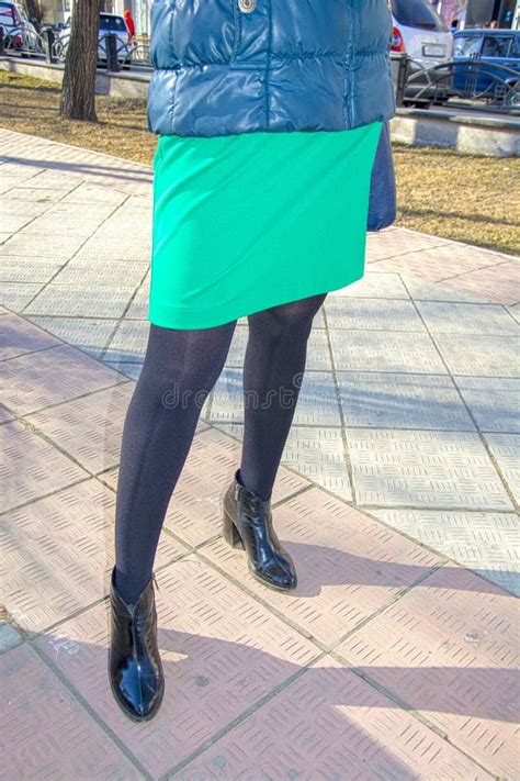 Women`s Legs In Black Nylon Pantyhose In Shoes With Heels On The