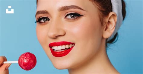 A Woman With Red Lipstick Holding A Lollipop Photo Free Ukraine Image
