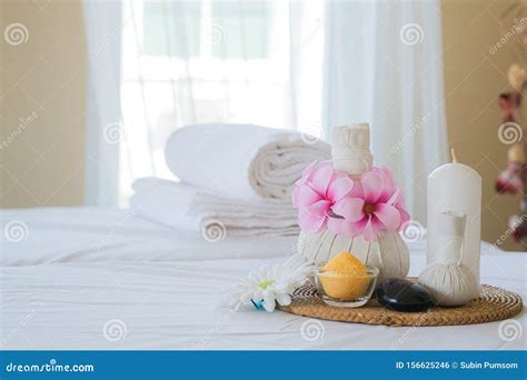 Spa Treatment Set And Aromatic Massage Oil On Bed Massage Thai Setting